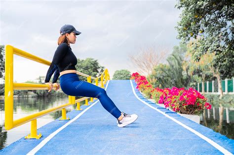 Premium Photo Young Beautiful Asian Woman In Sports Outfits Doing