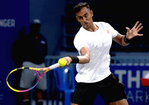 Indias Mukund Sasikumar During The Second Round Match Against Tunisias Moez Echargui At The