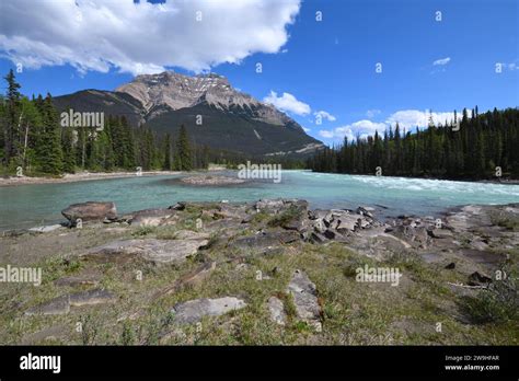 Mount Kerkeslin Dominates The Horizon Over The Athabasca River In