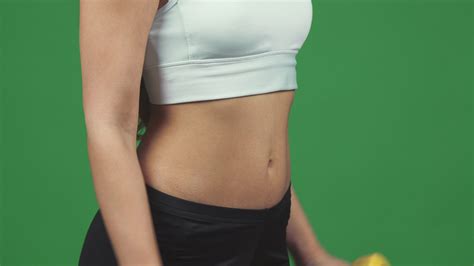 Cropped Close Up Of A Fitness Woman With Perfect Abs Exercising With Weights 31755926 Stock