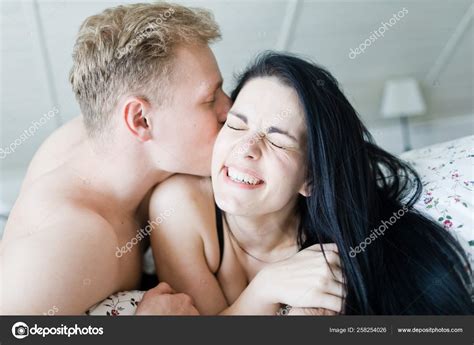 Handsome Man Kissing And Nice Woman In Bed Stock Photo Marek Stillandmotionpictures Com