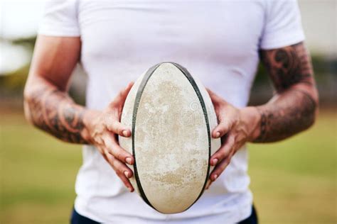 Are You Ready For A Game Of Rugby An Unrecognisable Man Holding A