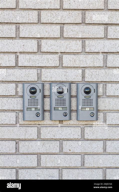 Three Modern Intercom On White Wall Near Entrance To The House Space