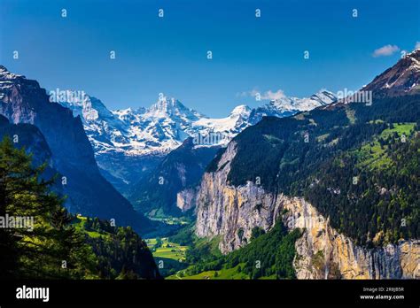 Lauterbrunnen Valley With The Staubbach Waterfall And Snowy Peaks Of