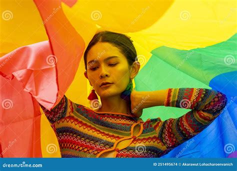 Elegance Transgender Model Woman In Colorful Rainbow Flag Costume Is