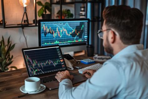 A Man Sits At A Desk With A Computer And A Graph Showing The Graph Graph Premium Ai Generated
