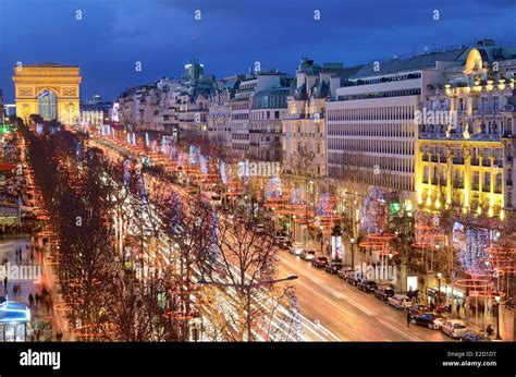 France Paris Champs Elysees Avenue With Christmas Lights And The Arch