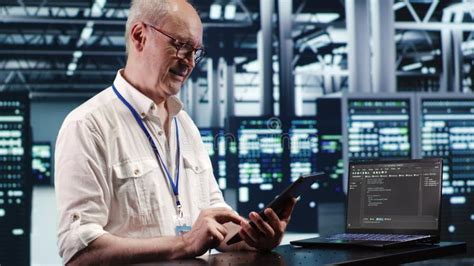 employee running code in data center stock footage video of