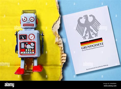 robot figure and german basic law symbolic photo ai regulations
