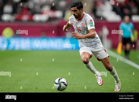 Tunisias Mohamed Ben Hmida Is In Action During The Group B Arab Cup Soccer Match Between Syria