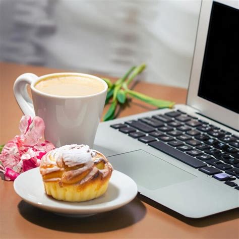 Premium Ai Image Computer Laptop With Mouse And Coffee Cup On Table