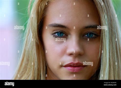 Outdoor Portrait Of Young Blonde Woman With Intense Gaze Natural