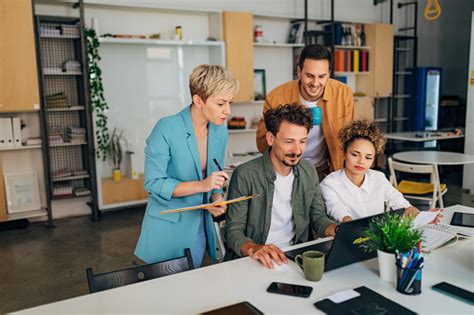 a group of new programmers learn the basics of coding a program stock