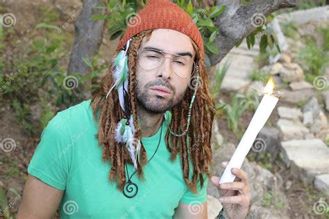 Hilarious Man Pretending To Smoke An Extra Large Joint Stock Image