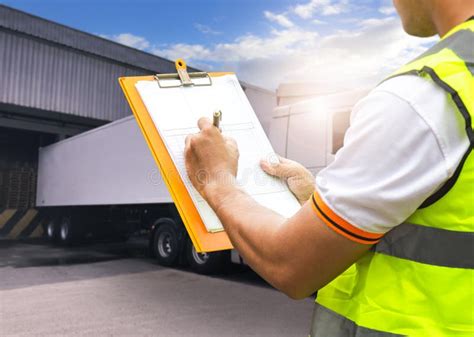 Close Up Worker Holding Clipboard Loading Control Trailer Truck Truck Parked Loading At Dock