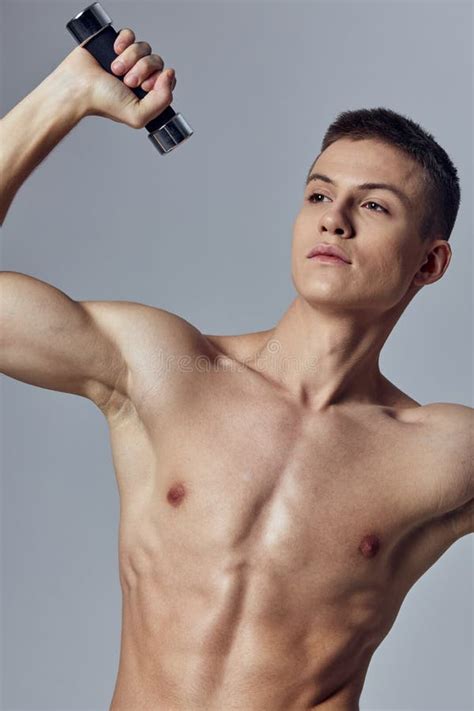 Cute Guy Athlete With Dumbbells In Hands Exercise Gym Workout Stock