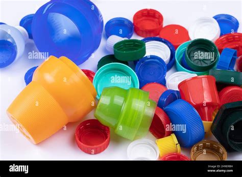 Closeup Of Vibrant And Colorful Plastic Container Caps On A White