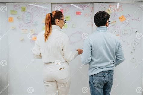 Collaborative Brainstorming Session In A Corporate Office With