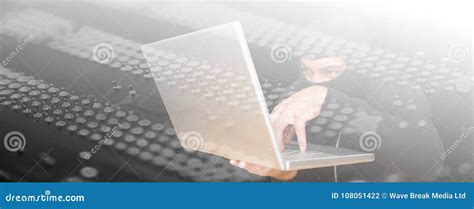 Composite Image Of Hacker Using Laptop To Steal Identity At Desk Stock Illustration