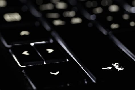 Premium Photo A Shift Key In Close Range Of A Illuminated Keyboard By Led Back Light