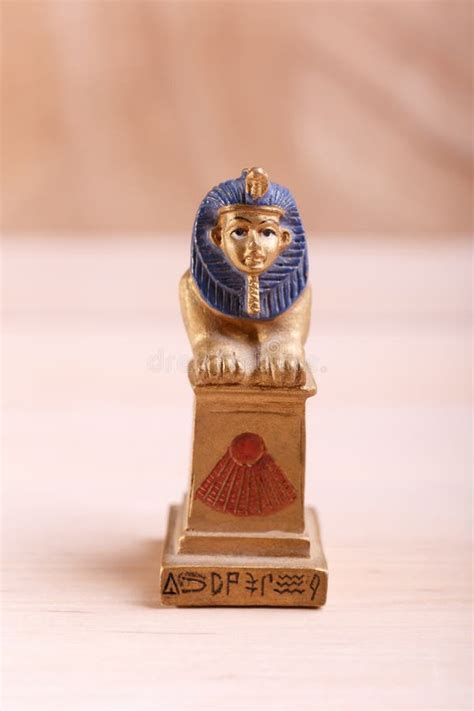 A Statuette Of A Sphinx With Blue Mane Stock Image Image Of Game Golden 120688299