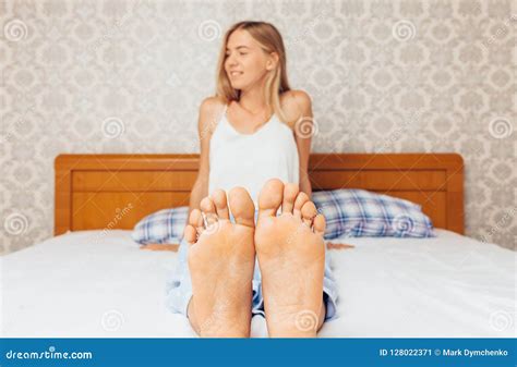 Girl`s Feet On White Blanket On Bed Girl Woke Up In Bed In Morn