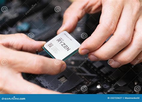 hand holding computer processor chip electronic engineer installing
