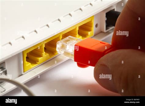 Ethernet Cable Plugging Into Broadband Modem Stock Photo Alamy