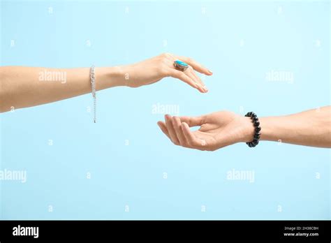 Man And Woman Reaching Out To Each Other On Blue Background Stock Photo Alamy