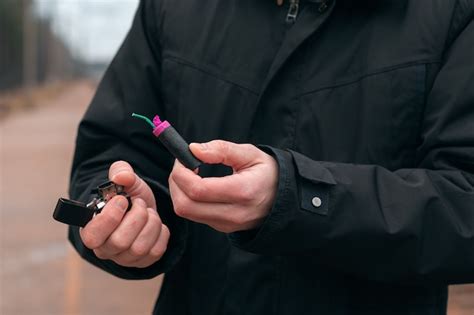 Premium Photo Setting Firecracker On Fire