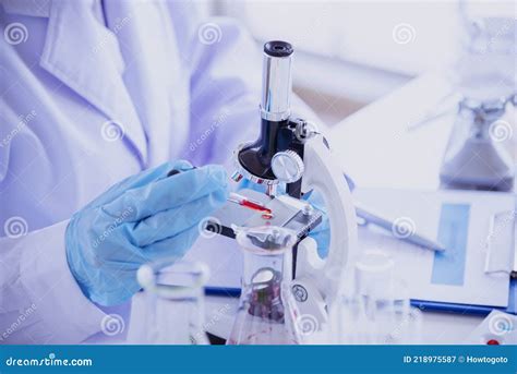 Female Scientist Look At Microscope Science Test Tube Analyse Scientific Sample In Laboratory