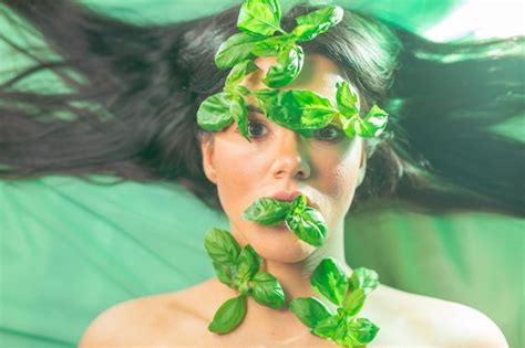 Premium Photo Directly Above Portrait Of Woman Lying Down With Leaves