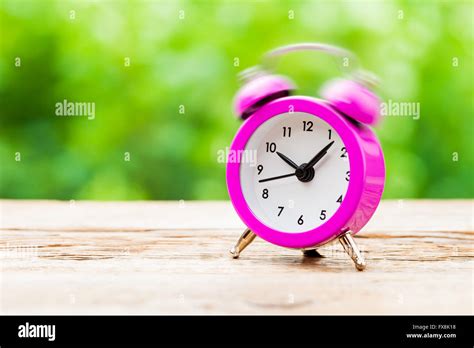 Ringing Pink Alarm Clock Stock Photo Alamy