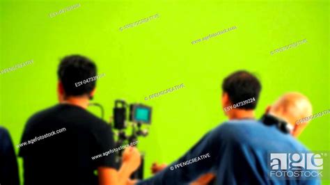Blurred Behind The Scenes Of Video Movie Production In Big Studio With Chromatic Green Screen