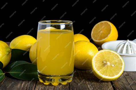 Premium Photo | Squeezing lemon juice with hand juicer