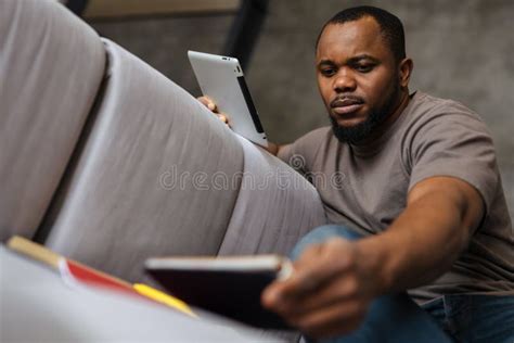 Black Unshaven Man Using Tablet Computer While Working Stock Image Image Of Tablet Indoors