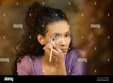 Attractive Young Black Woman Doing Her Makeup Carefully Applying