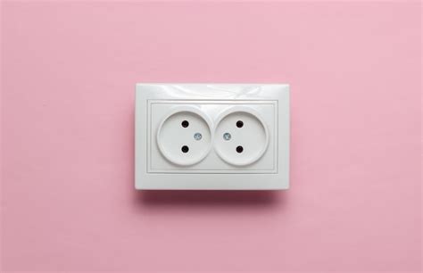 Premium Photo Double Power Socket On Pink Wall