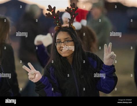 A Clovis High School Dance Team Member Flashes The Peace Sign During