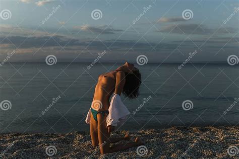 Brunette Woman Posing Naked On The Beach Perfect Slim Body Stock Image