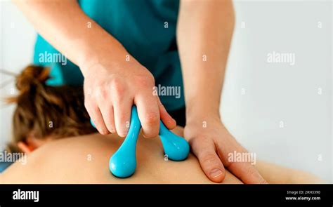Massage Therapists Hands Doing Back Massage With Special Massage