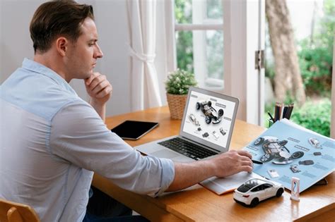 Premium Photo Car Designer Carefully Analyzing Car Prototype Synchronos