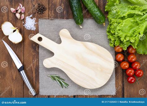 Cutting Board In The Shape Of A Guitar On A Wooden Table Handmade