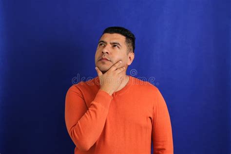 Latino Man In His Forties Appears Pensive And Thoughtful Stock Photo Image Of Space Solution