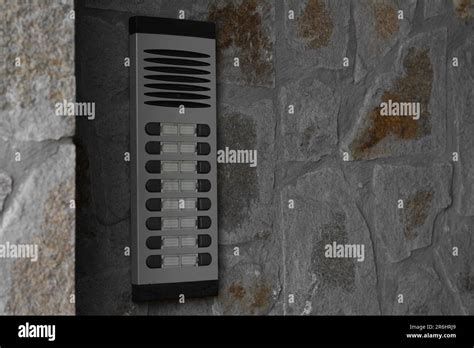 Modern Intercom On Concrete Wall With Stone Fragments Space For Text Security System Stock
