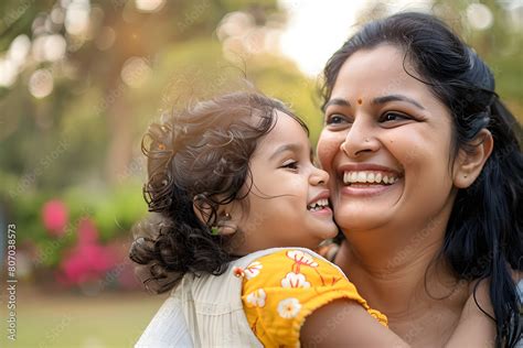Happy Indian Mother Having Fun With Her Daughter Outdoor Family