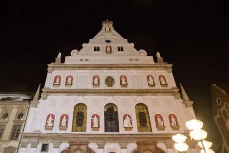 Stunning Night View Of Historic White Stucco Church With Statues And