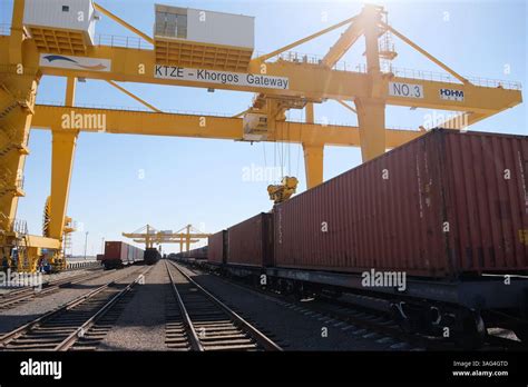 unloading containers at the logistics center machines and cranes drag