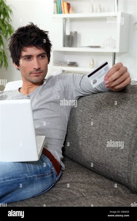 Man Using His Credit Card Online Stock Photo Alamy
