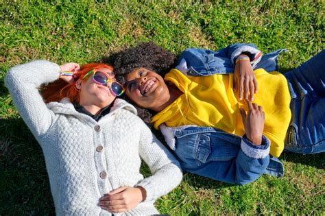 Premium Photo Shot From Above Of Multiracial Lesbian Couple Lying On